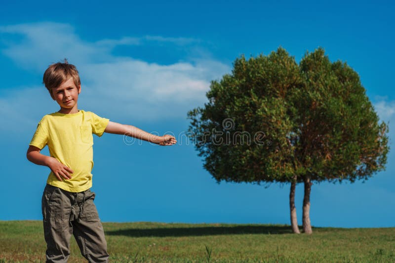 Boy Points To the Tree on a Sunny Day, Ecology Concept Stock Photo ...