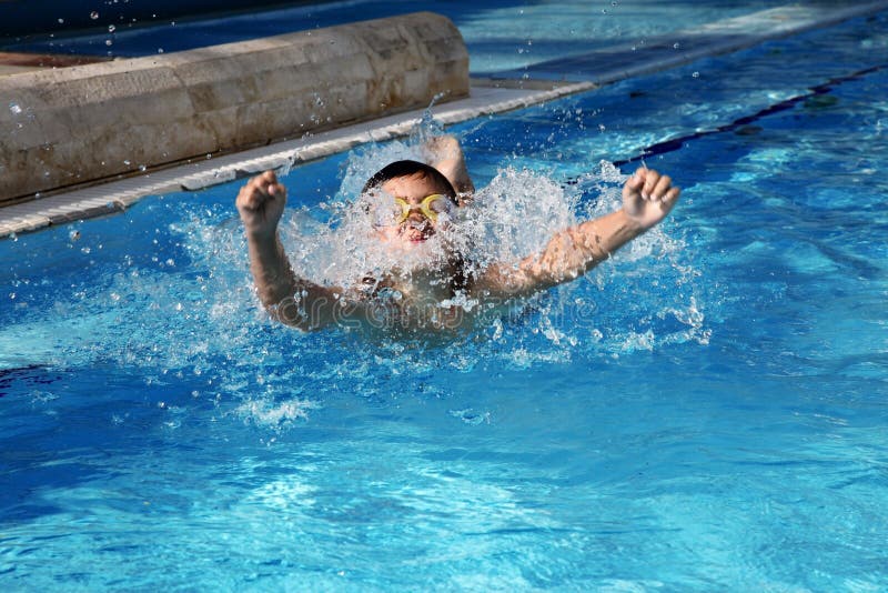 Boy in the pool stock photo. Image of playful, strong - 18003192