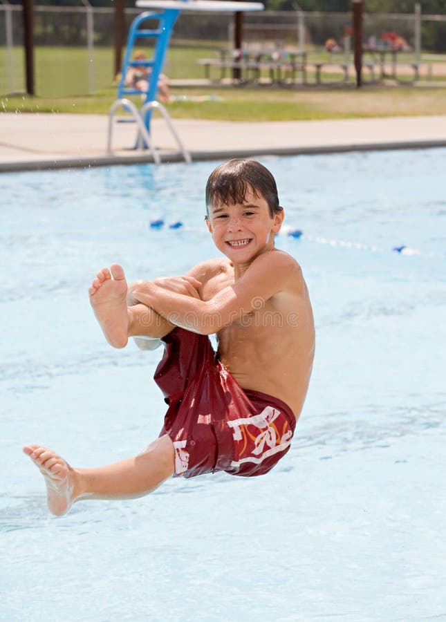 Young Boy Jumping into Swimming Pool Stock Image - Image of fitness ...