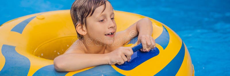 Boy on a Pool Float on Artificial Waves in a Water Park BANNER, LONG ...