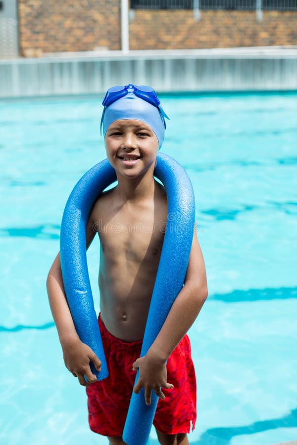 Boy with Pool Noodle Smiling at Camera Stock Photo - Image of swimming ...