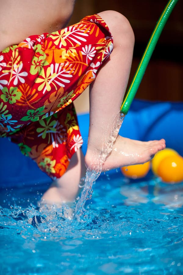 Boy in Pool Playing with Water Stock Photo - Image of pool, color: 9530432
