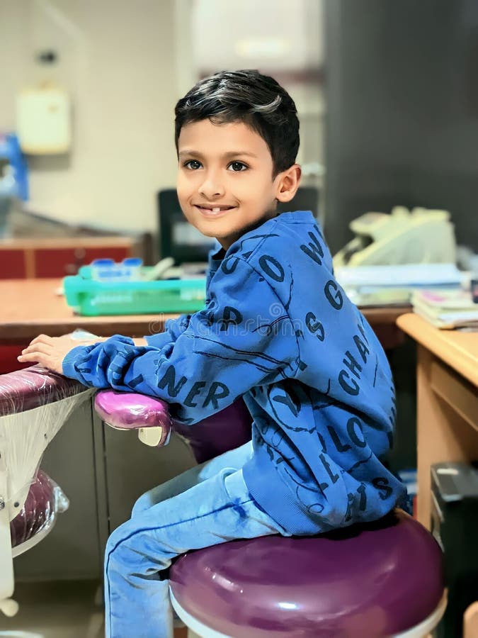 Boy Portrait Sitting in an Office Chair Stock Photo - Image of sitting ...