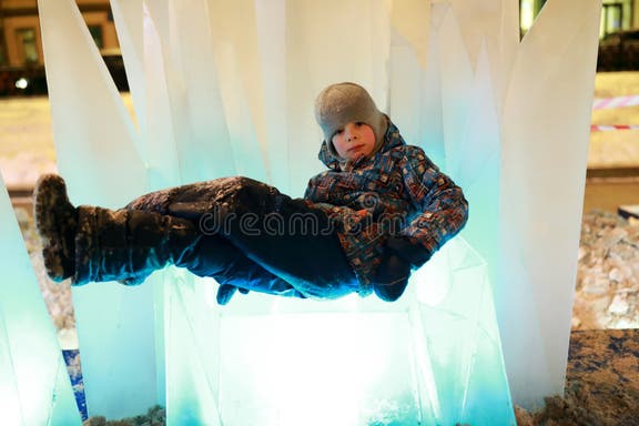 Boy posing on ice throne stock image. Image of armchair - 137243225