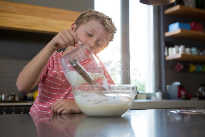 Boy Pouring Milk Batter Stock Photos - Free & Royalty-Free Stock Photos ...