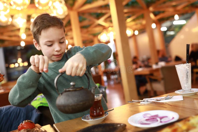 Boy Pouring Tea into Turkish Glass Stock Image - Image of breakfast ...