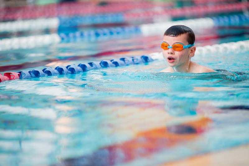 Boy swimming Freestyle stock image. Image of athlete - 109726271