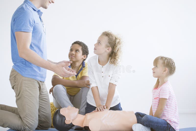 Boys Practicing CPR stock photo. Image of education, teen - 20228324