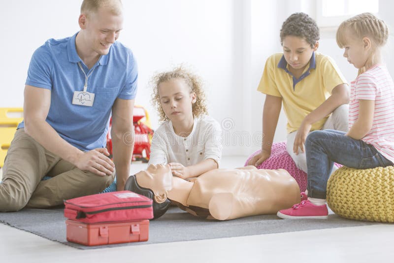 Boy Practicing Reanimation on Manikin Stock Photo - Image of emergency ...