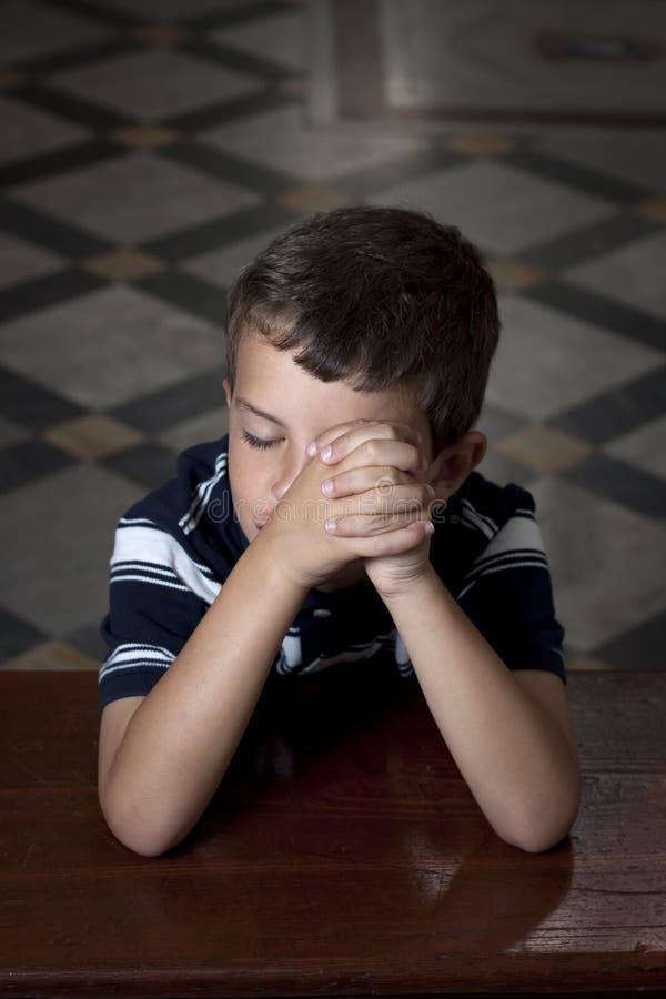 Young Boy Praying stock image. Image of back, pure, kneeling - 7135211