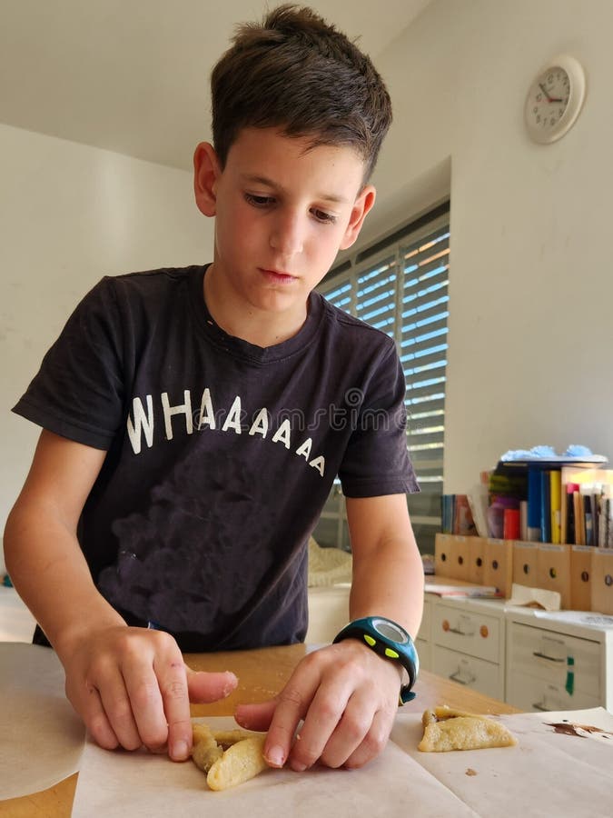 Boy Preparing Cookies on the Table in the Kitchen Stock Photo - Image ...