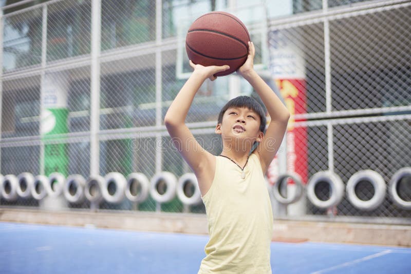 Boy Preparing for Shooting at Basketball Court Stock Photo - Image of ...