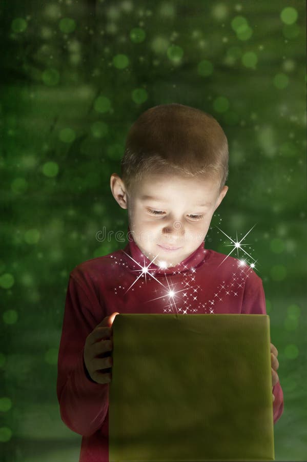 Boy with Present, Light Coming Out of the Box Stock Image - Image of ...