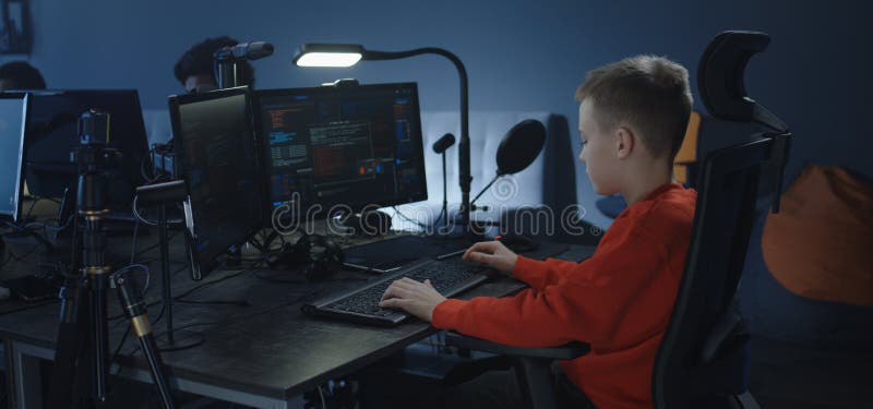 Boy Programming in an Office Stock Photo - Image of competence, indoors ...