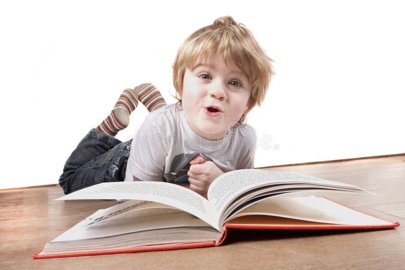 Boy Pulling Funny Face Whilst Reading Book Stock Photos - Free ...