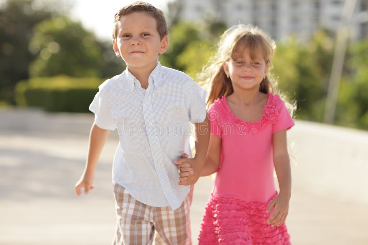 107 Girl Boy Pulling Hands Stock Photos - Free & Royalty-Free Stock ...
