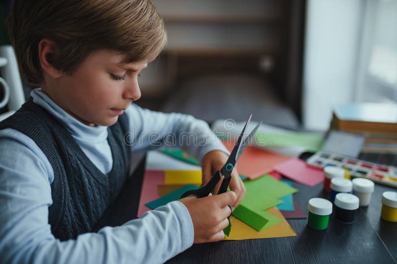 Boy Pupil Doing Paper Cut Lesson Stock Photo - Image of table ...