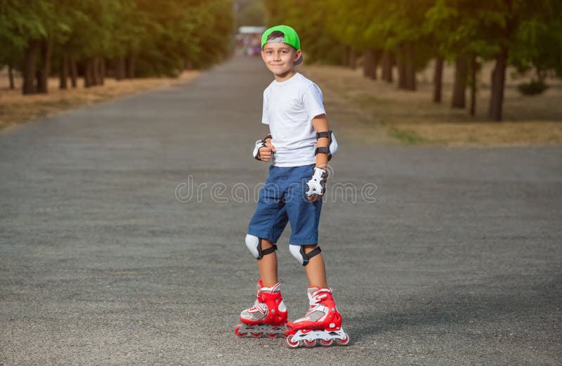 In the Summer in the Park, a Boy and a Girl Roll on Roller Skates Stock ...