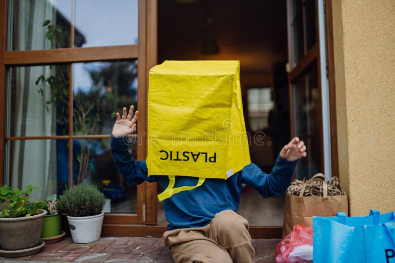Boy Put Recycling Bag for Plastic Waste on Head. Boy Sorting the Waste ...