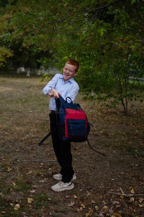 A Boy Puts a School Backpack on His Back Stock Photo - Image of leisure ...
