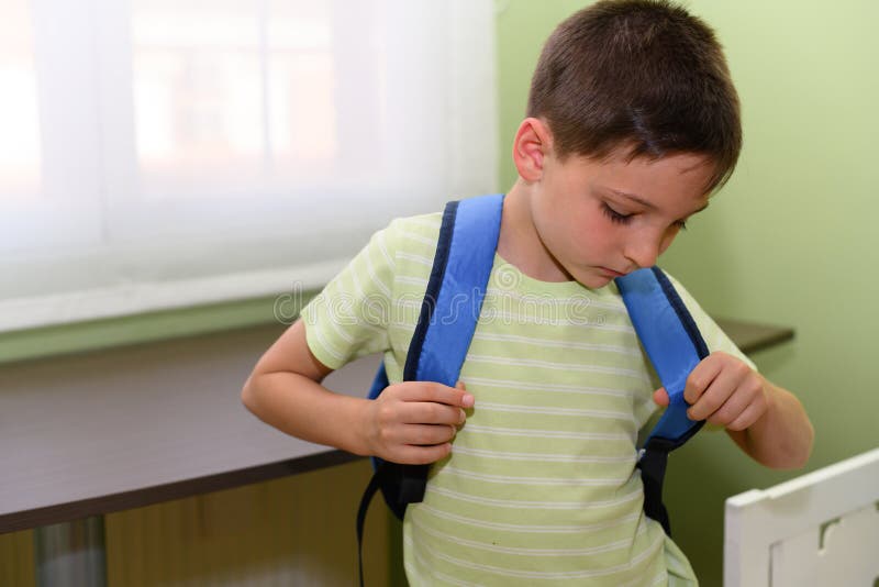 Boy Putting on His Backpack at Home Stock Image - Image of pupil ...