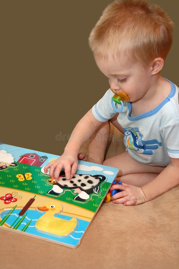 Boy and Puzzle stock photo. Image of little, party, male - 5991840