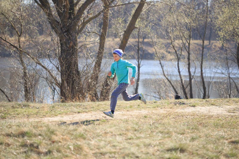 The Boy Quickly Runs on Nature in the Spring Stock Photo - Image of ...