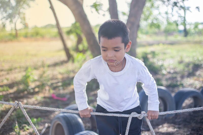 The Boy Ran with a Rope Hanging in an Amusement Park Stock Photo ...