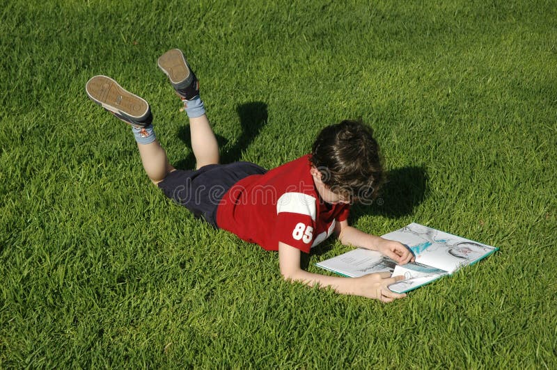 Boy reading stock image. Image of face, teen, summer, young - 858891