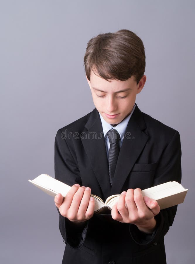 Boy reading Bible stock image. Image of school, child - 3642671