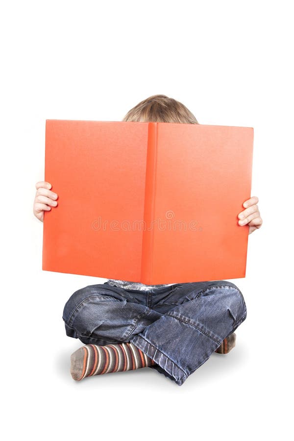 Boy reading a big book stock photo. Image of primary - 23294842
