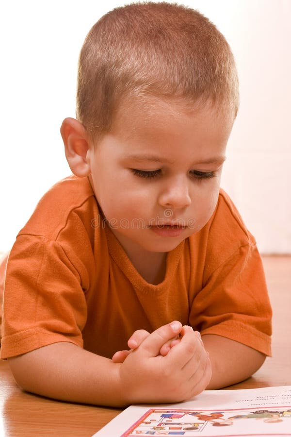 Boy reading book stock photo. Image of preschool, talking - 10386418