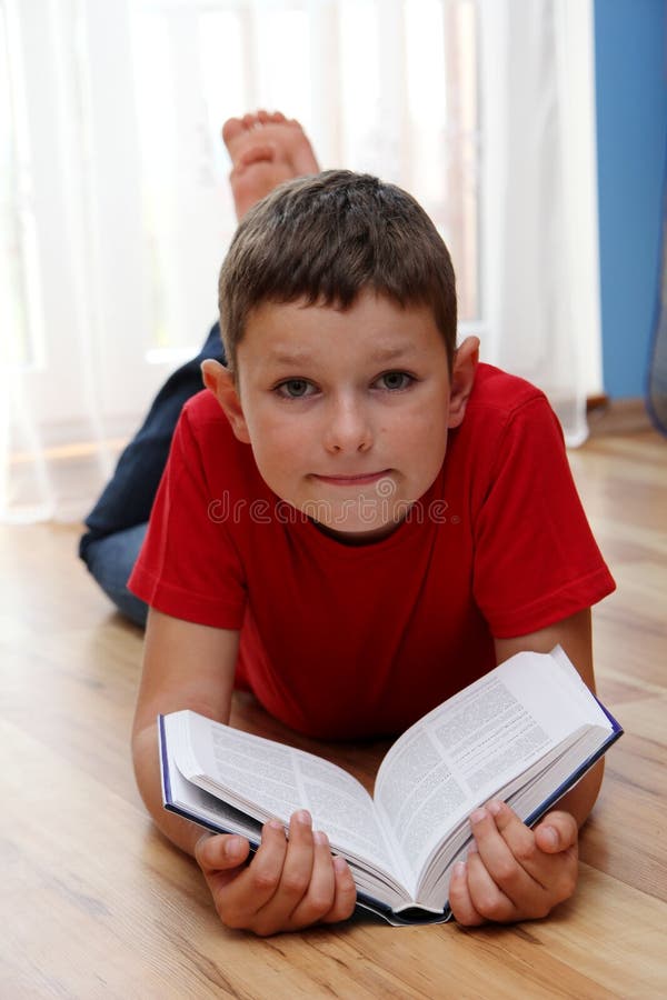 Boy reading book stock image. Image of floor, literature - 15596747
