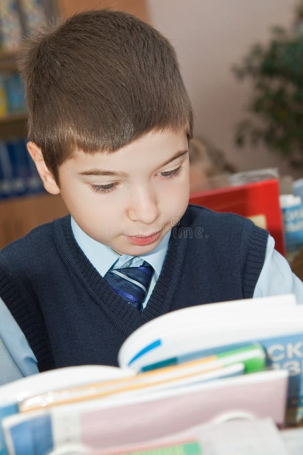 Boy reading a book stock photo. Image of person, male - 16292078