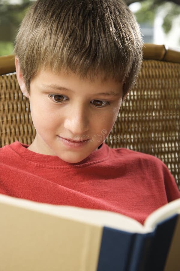 Boy reading book. stock image. Image of shoulders, years - 2038175