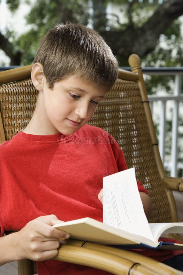 Boy reading book. stock image. Image of teen, vertical - 2046119