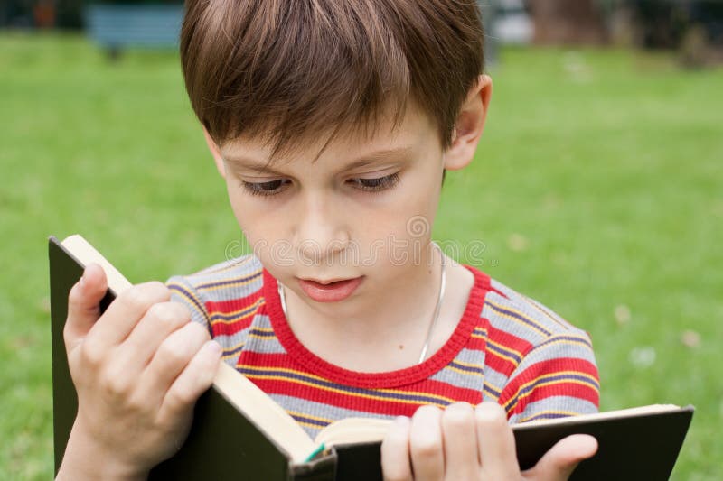 Little Boy Reading a Book Outdoors Stock Image - Image of leisure ...