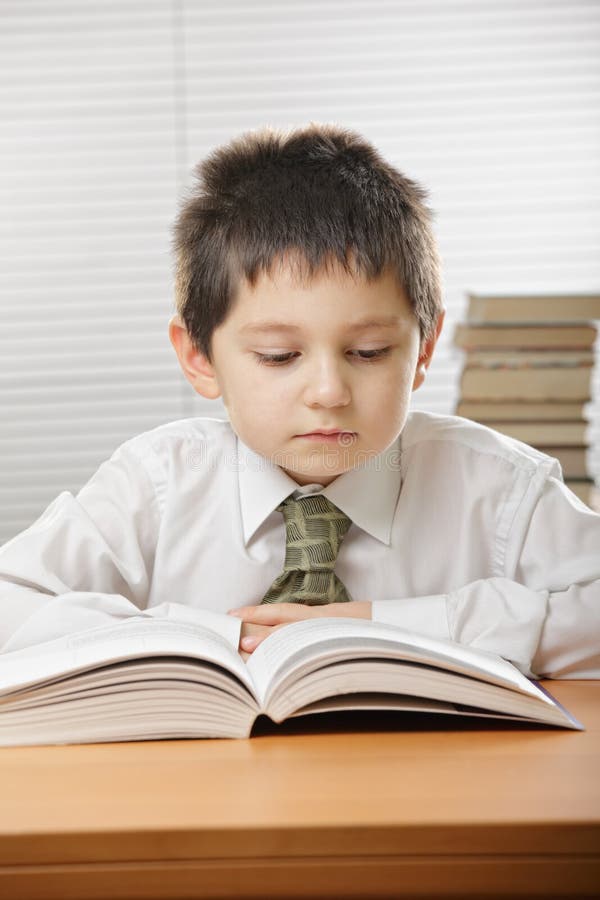 Boy reading book stock photo. Image of person, necktie - 26461722