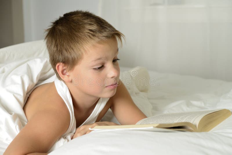 Boy is reading a book stock photo. Image of attractive - 27059106