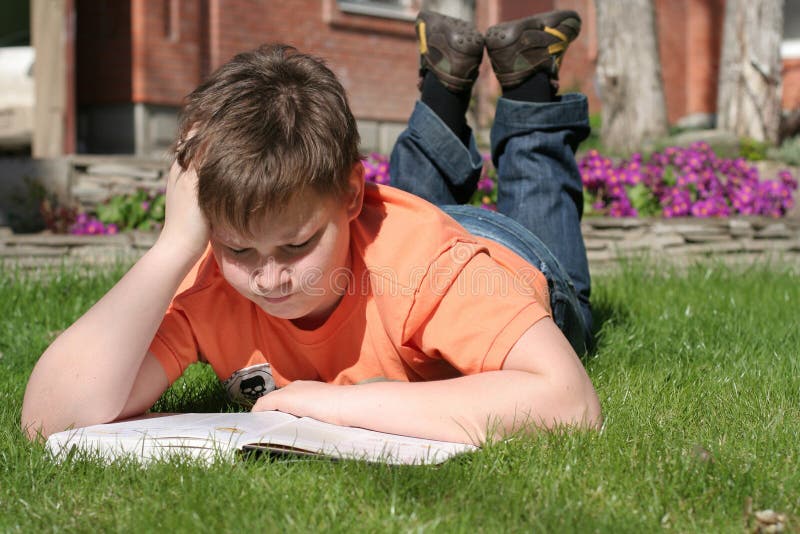 Boy is reading a book stock image. Image of book, resting - 2888459