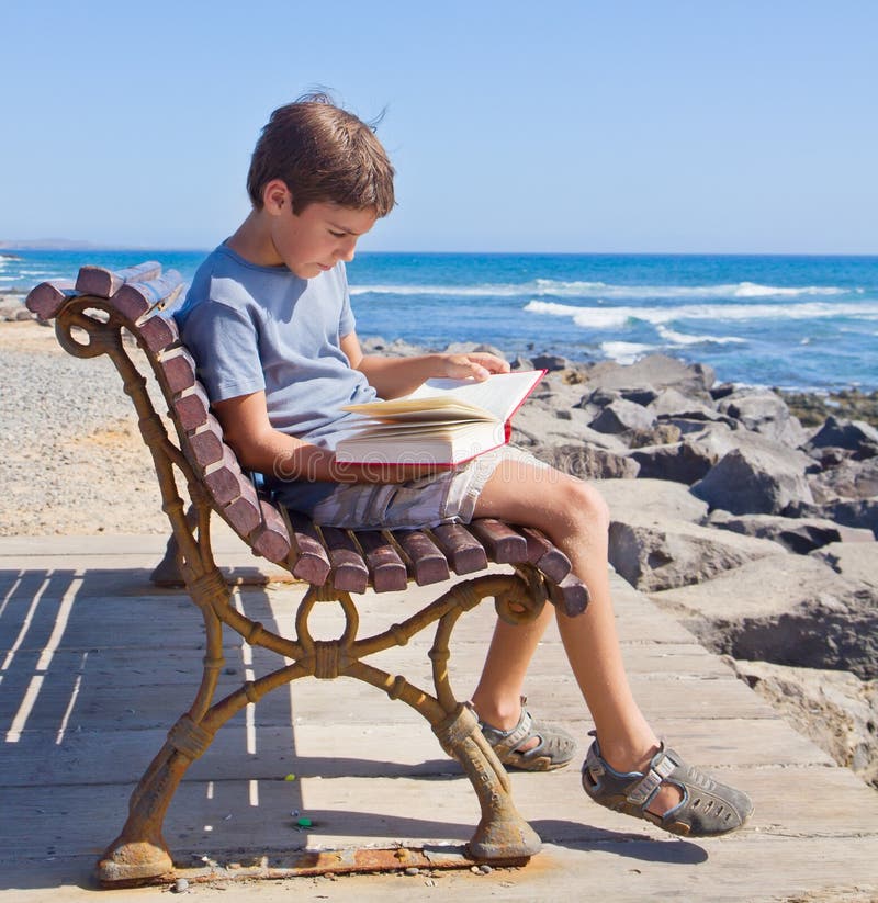 Boy reading book stock photo. Image of school, beautiful - 22675782
