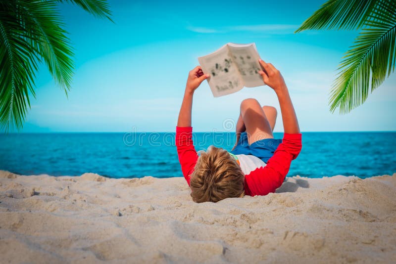 Boy Reading Book at Beach Vacation, Summer Reading Stock Photo - Image ...