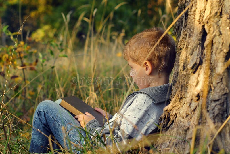 246 Boy Reading Book Under Tree Stock Photos - Free & Royalty-Free ...