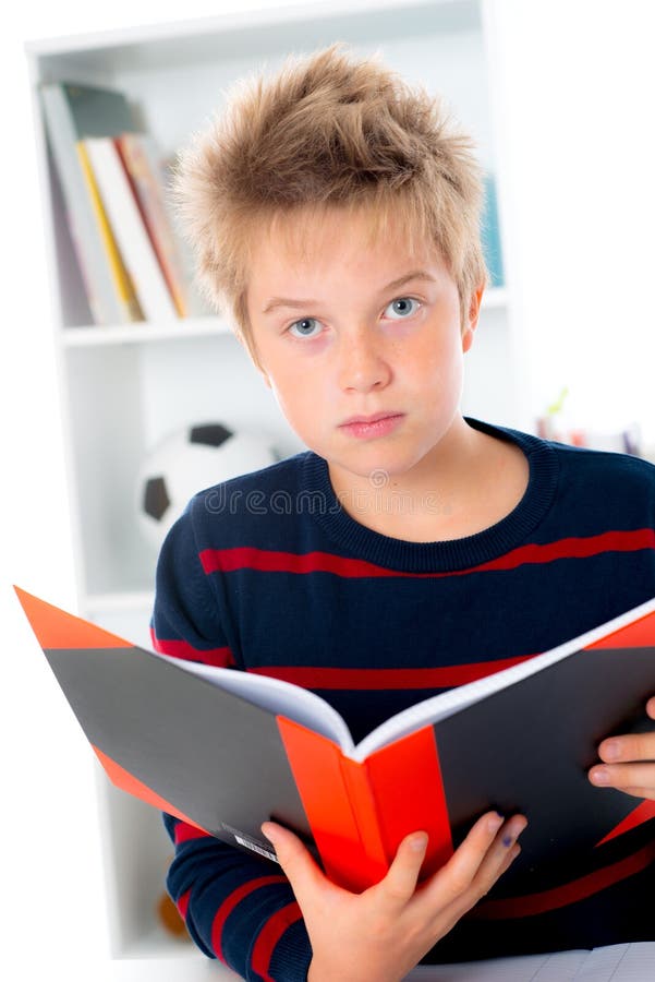 Boy is reading a book stock image. Image of school, caucasian - 45717535