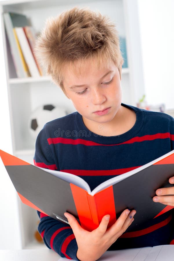 Boy is reading a book stock photo. Image of male, intelligent - 48534674