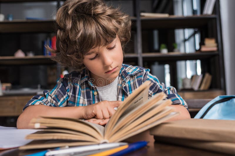 Boy reading book stock photo. Image of alone, childhood - 103862446