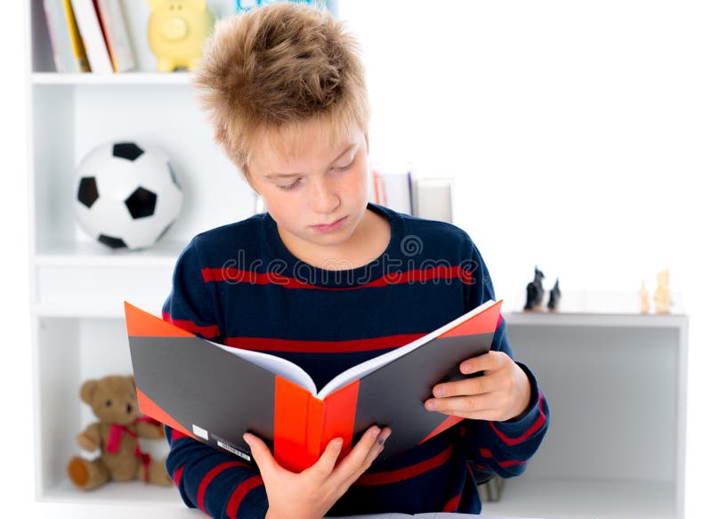 Boy is reading a book stock image. Image of cerebration - 44985515