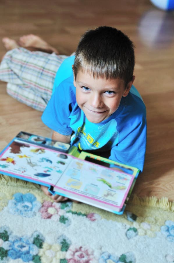 Boy reading a book stock photo. Image of happiness, junior - 31242360