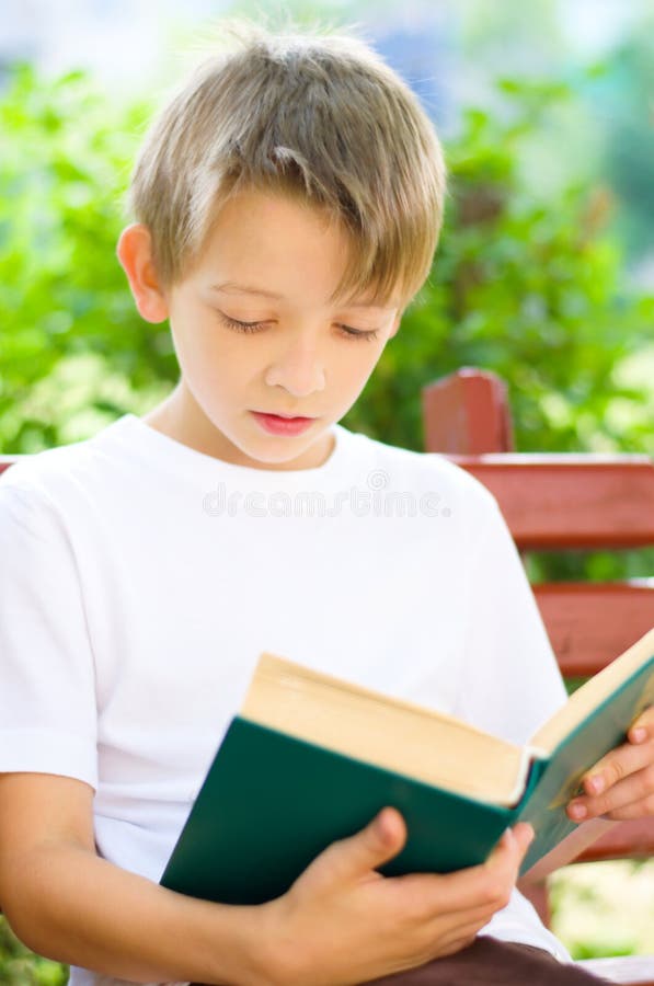 Boy reading book stock photo. Image of education, outside - 33337308