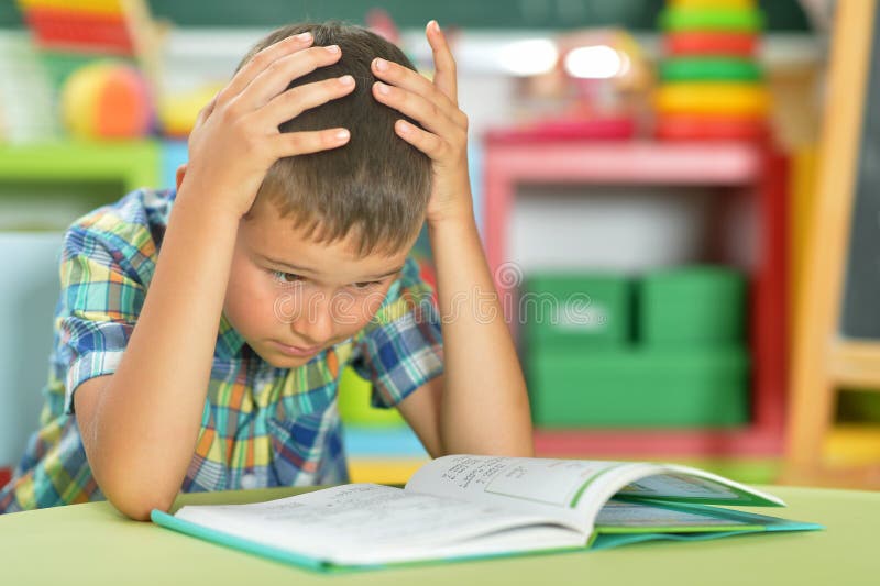 Boy reading book stock photo. Image of think, classroom - 120887702